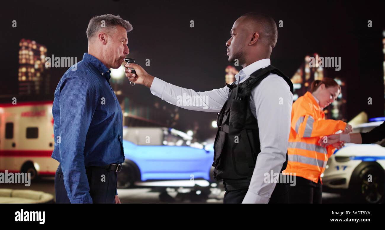 Police Officer Administering Breathalyzer Test To Intoxicated Female ...