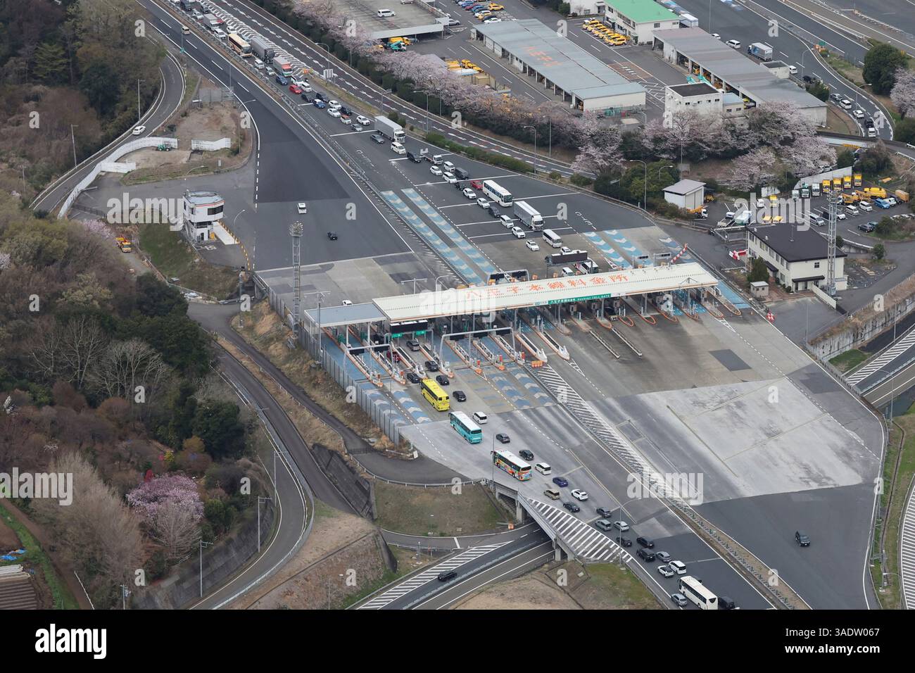 An aerial photo shows traffic jams for vehicles using manned toll gates ...