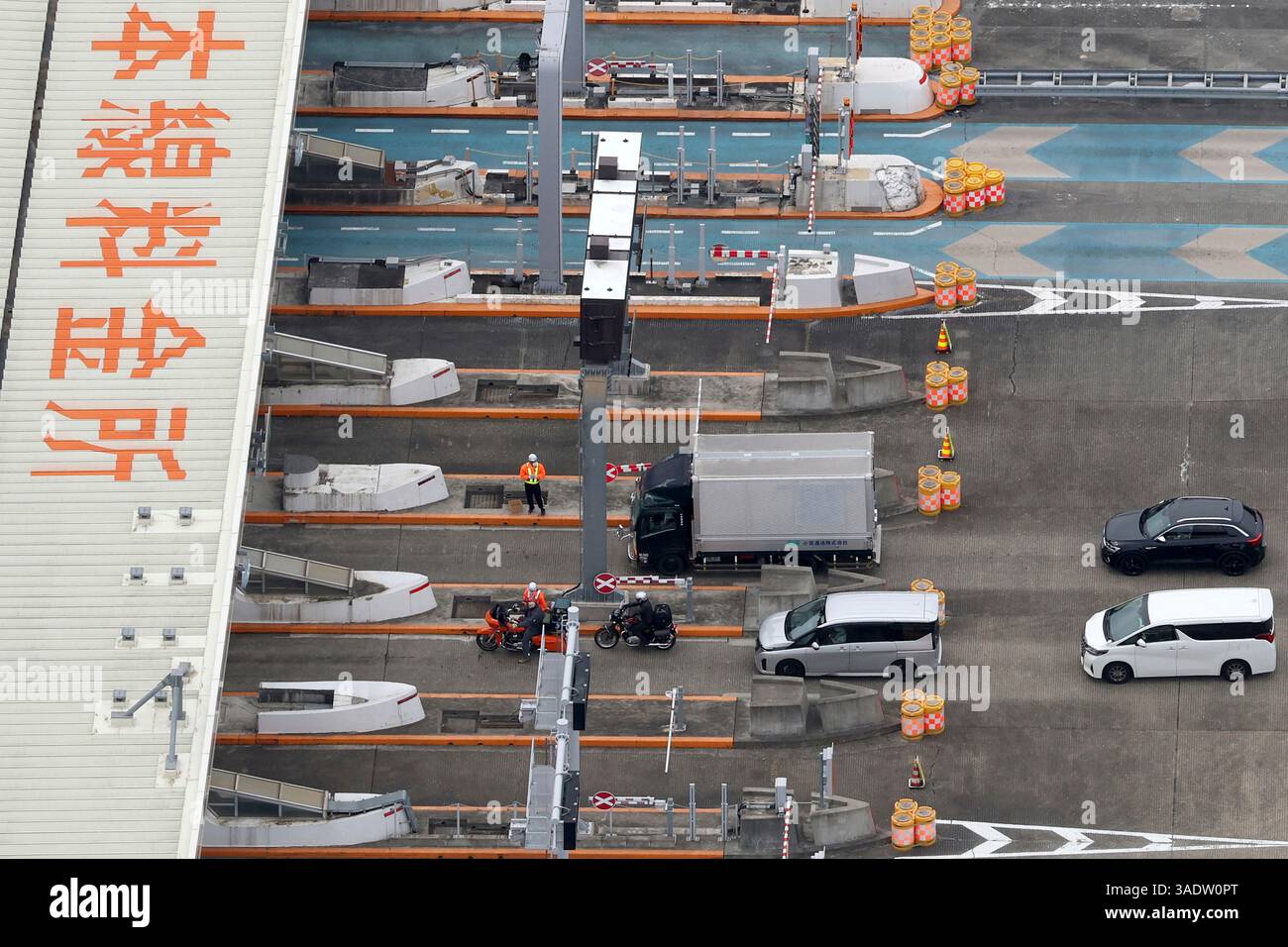 An aerial photo shows traffic jams for vehicles using manned toll gates ...