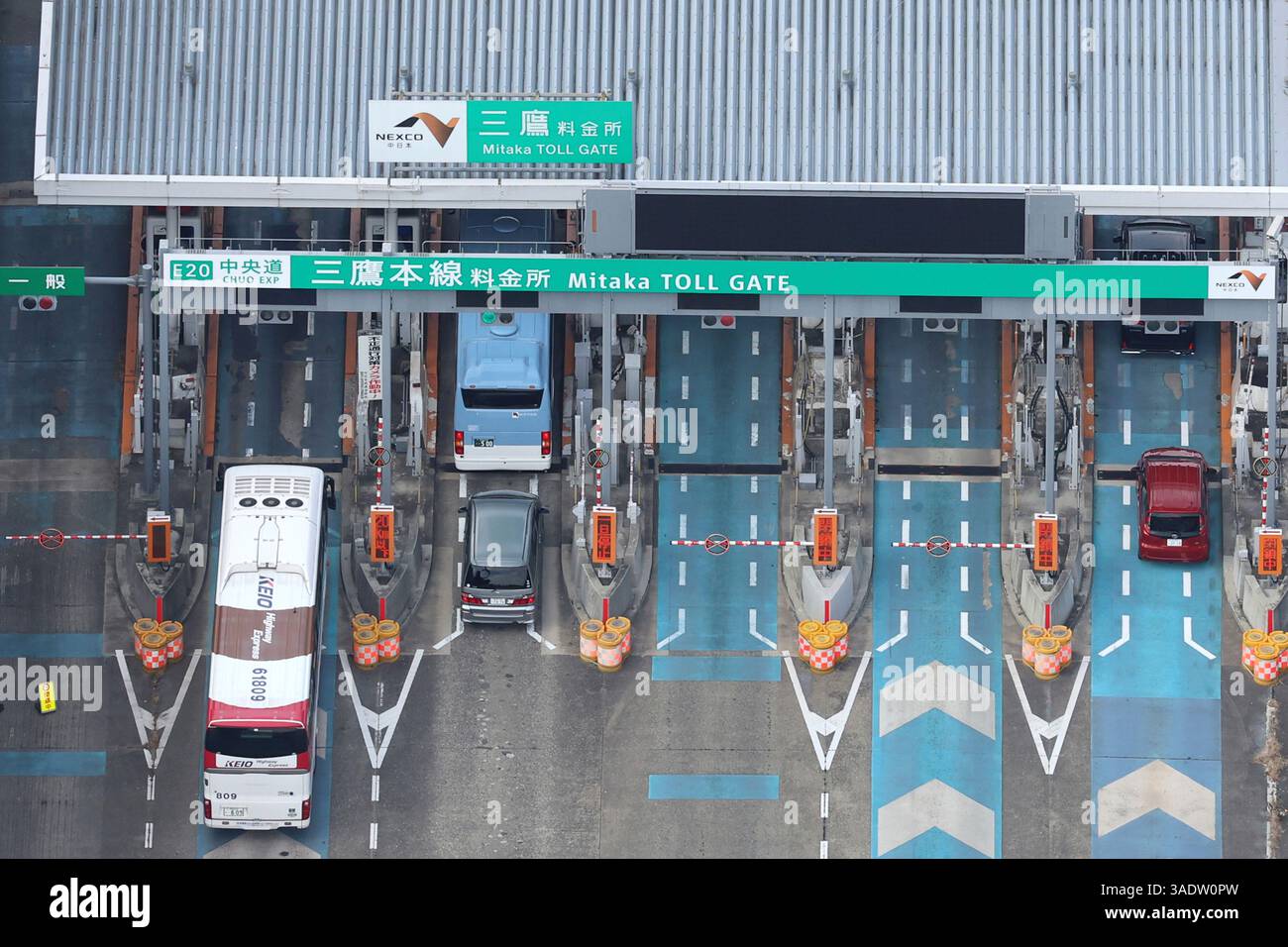 An aerial photo shows traffic jams for vehicles using manned toll gates ...