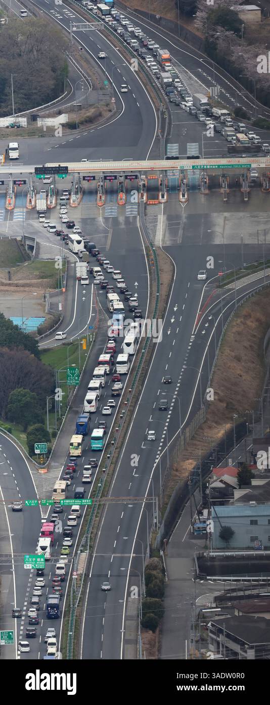 An aerial photo shows traffic jams for vehicles using manned toll gates ...