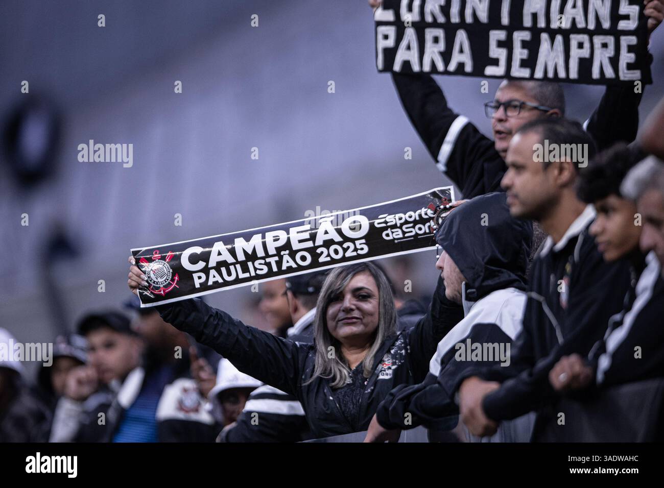 SÃO PAULO, BRAZIL - APRIL 5: Supporter of Corinthians with a banner ...