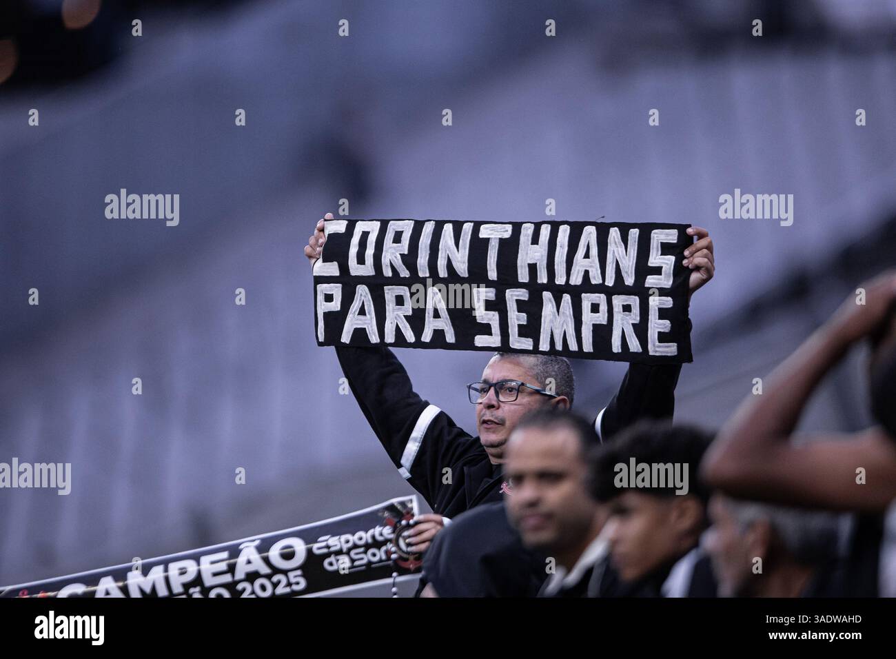 SÃO PAULO, BRAZIL - APRIL 5: Supporter of Corinthians with a banner ...