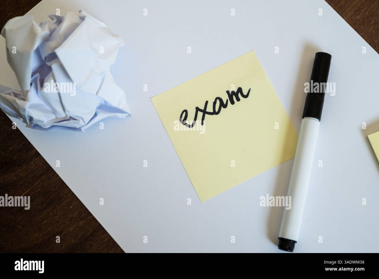 word exam written with black pen on paper - a reminder of school ...