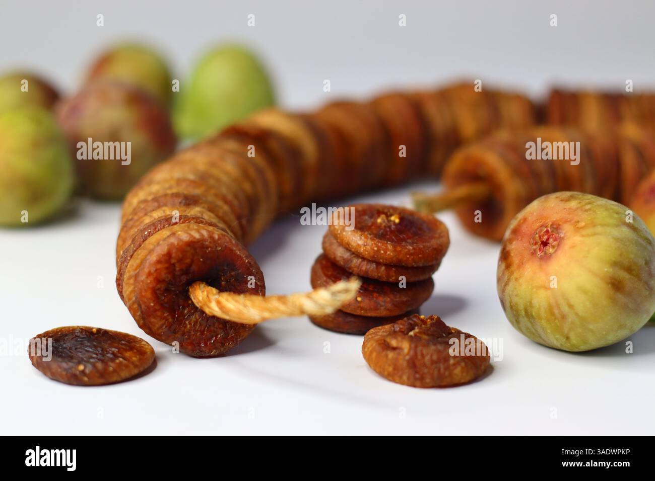 Dried and fresh figs on a white background, highlighting their color ...