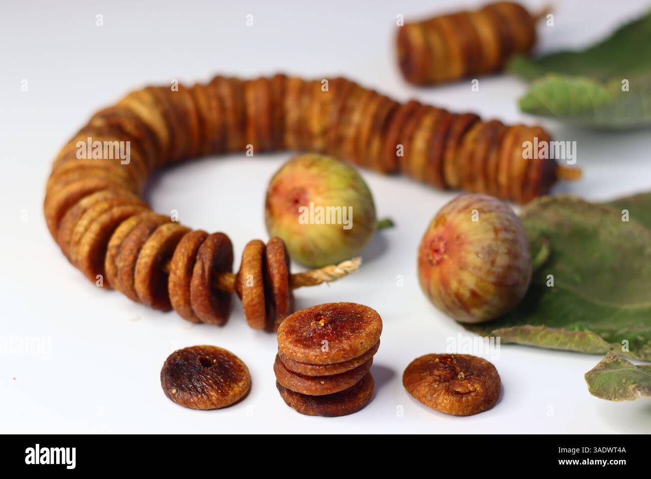 Dried and fresh figs on a white background, highlighting their color ...