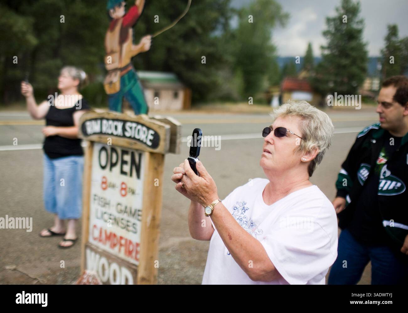 Earline Ceres, 62, of Old Station stands with her family Thursday as ...