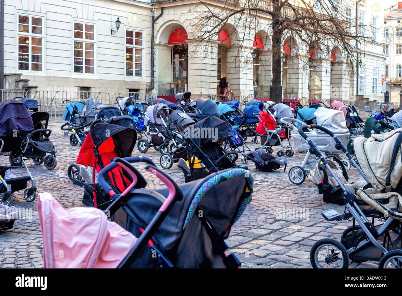 Many empty prams parked on city street paving stone in Lviv, Ukraine ...