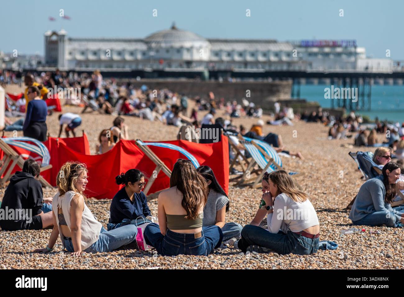 Brighton, April 5th 2025: Crowds enjoying the spring sunshine on Brighton beach this afternoon ...
