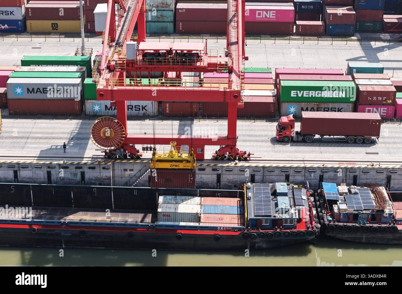 HANGZHOU, CHINA - APRIL 6, 2025 - Bridge cranes are used to load and ...