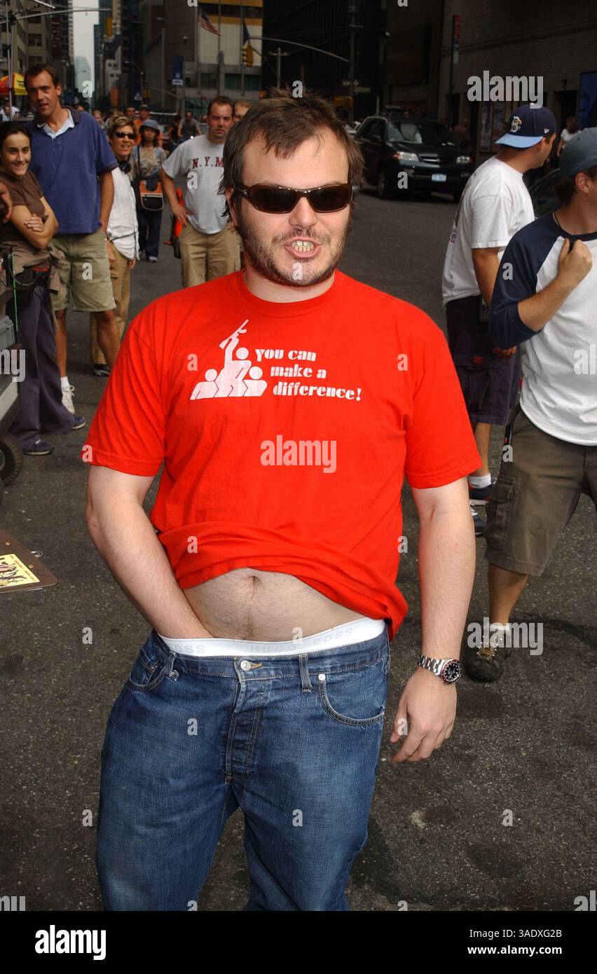 Actor/comedian JACK BLACK, wearing sunglasses and putting his hand down ...
