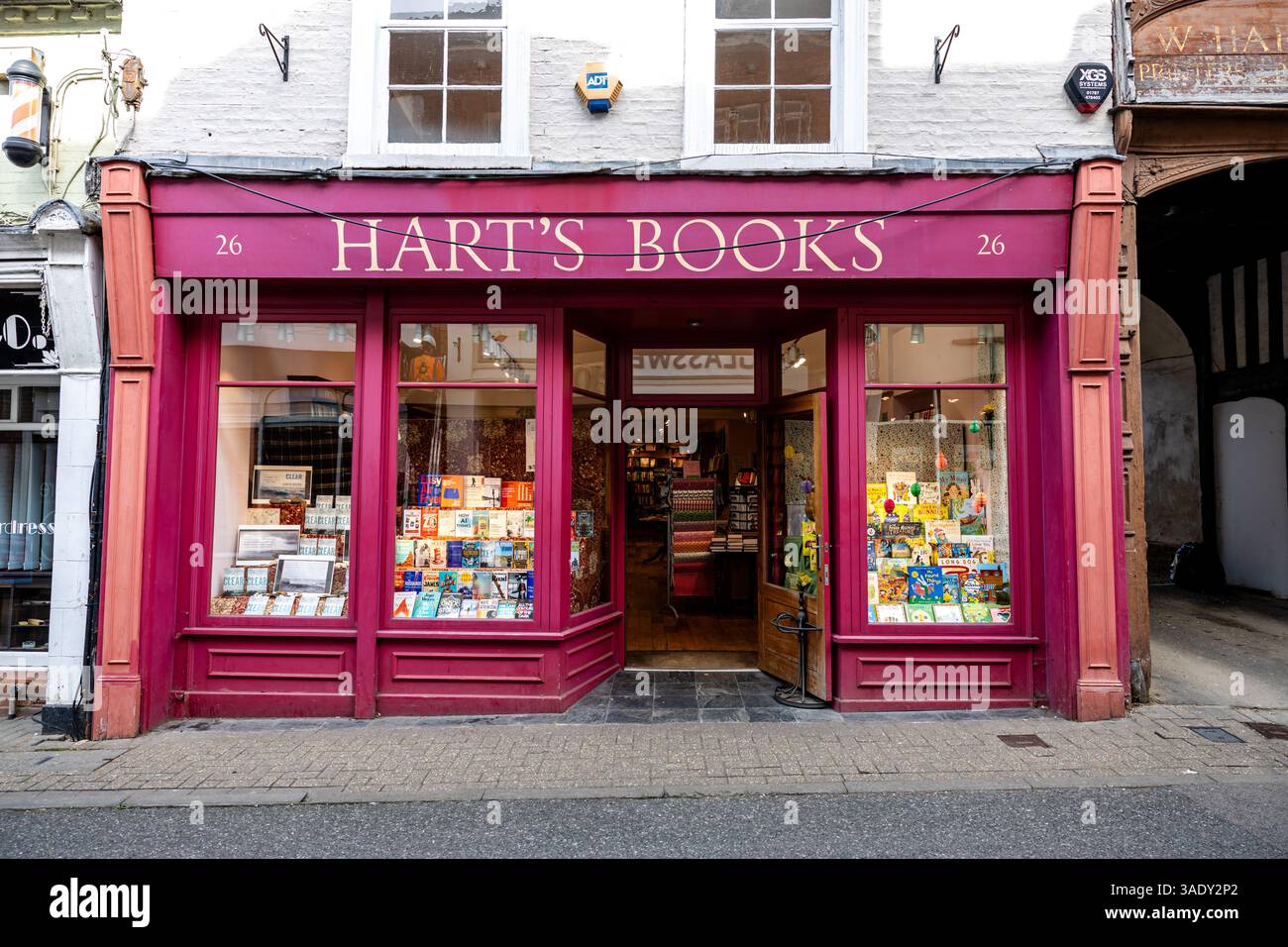 Exterior of Hart's Books storefront, with its distinctive red facade ...