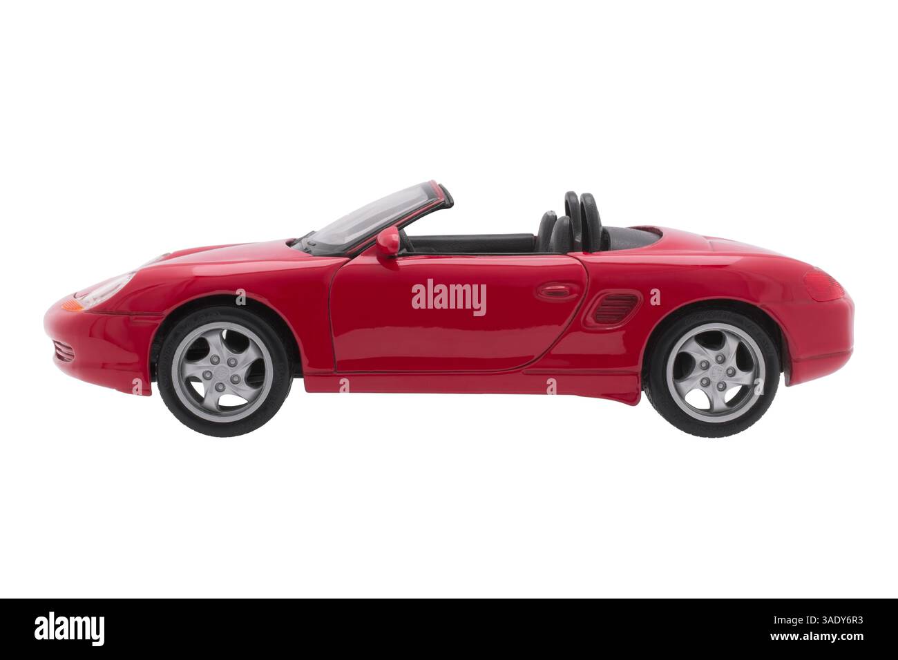 Red Porsche Boxster cabriolet die cast toy car on white background ...