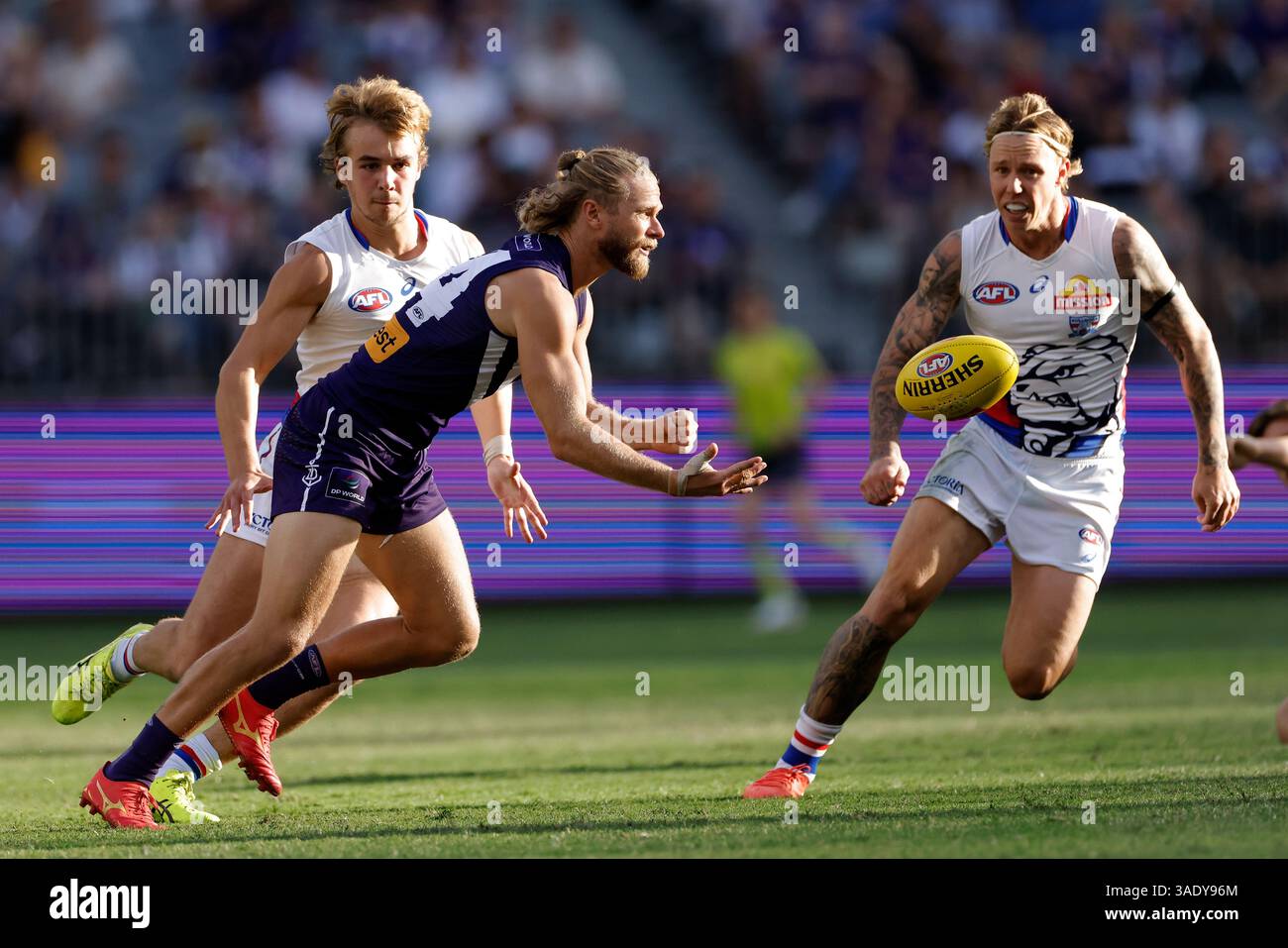 Perth, Australia. 06th Apr, 2025. Corey Wagner of the Dockers handballs ...