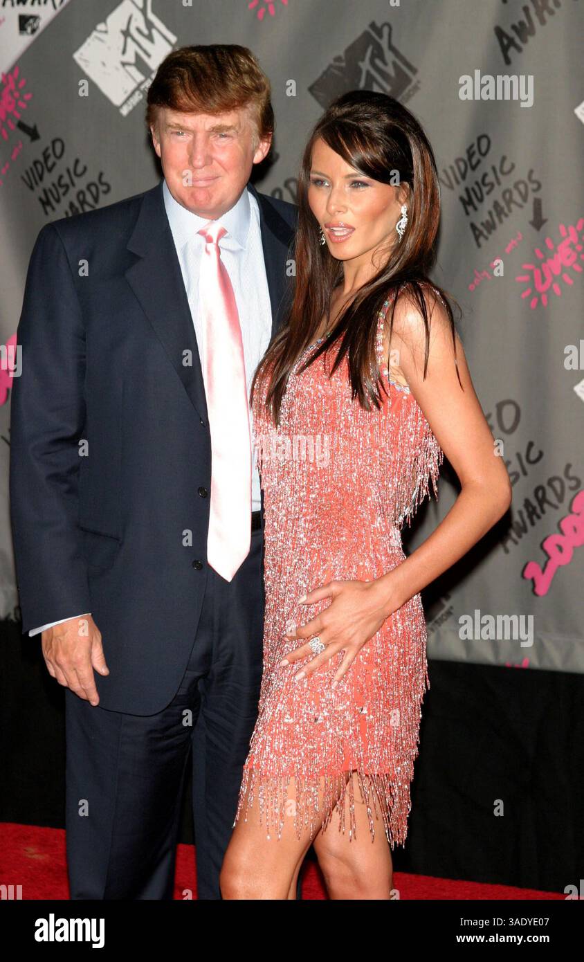 DONALD TRUMP & girlfriend model MELANIA KNAUSS arriving for the 2003 ...
