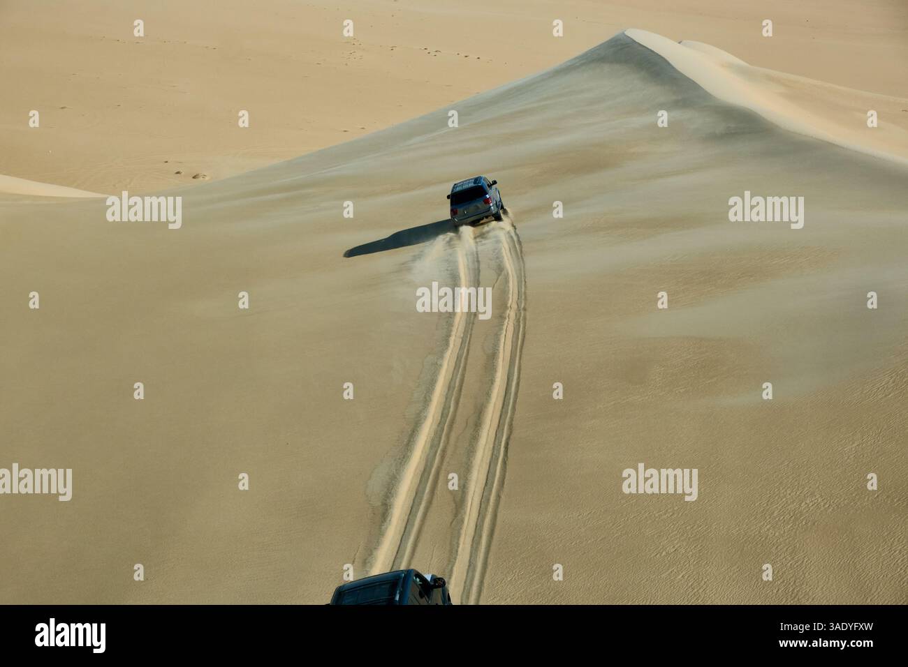Cars speeding in a desert Stock Photo - Alamy