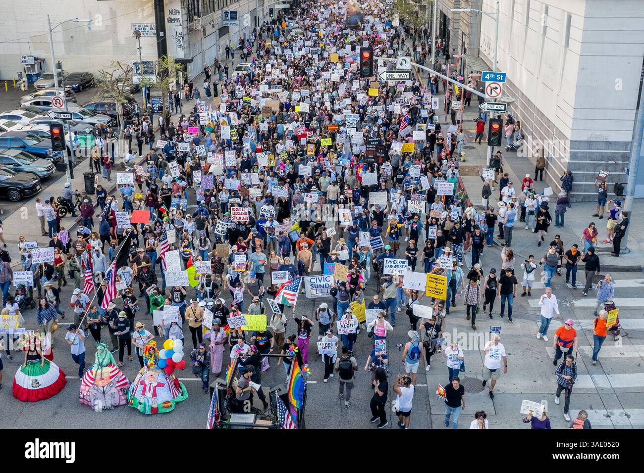 Protesters hold placards expressing their opinion in a march and ...