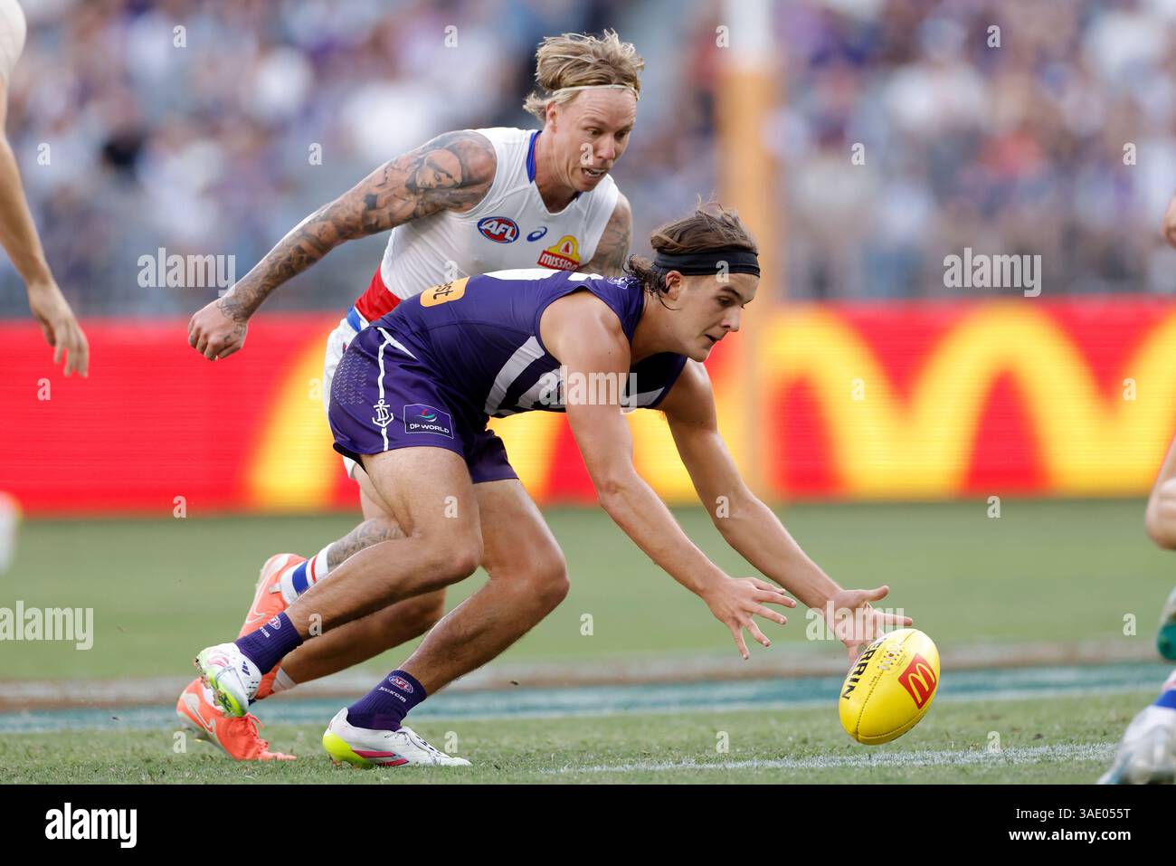Murphy Reid of the Dockers under pressure from James Harmes of the ...