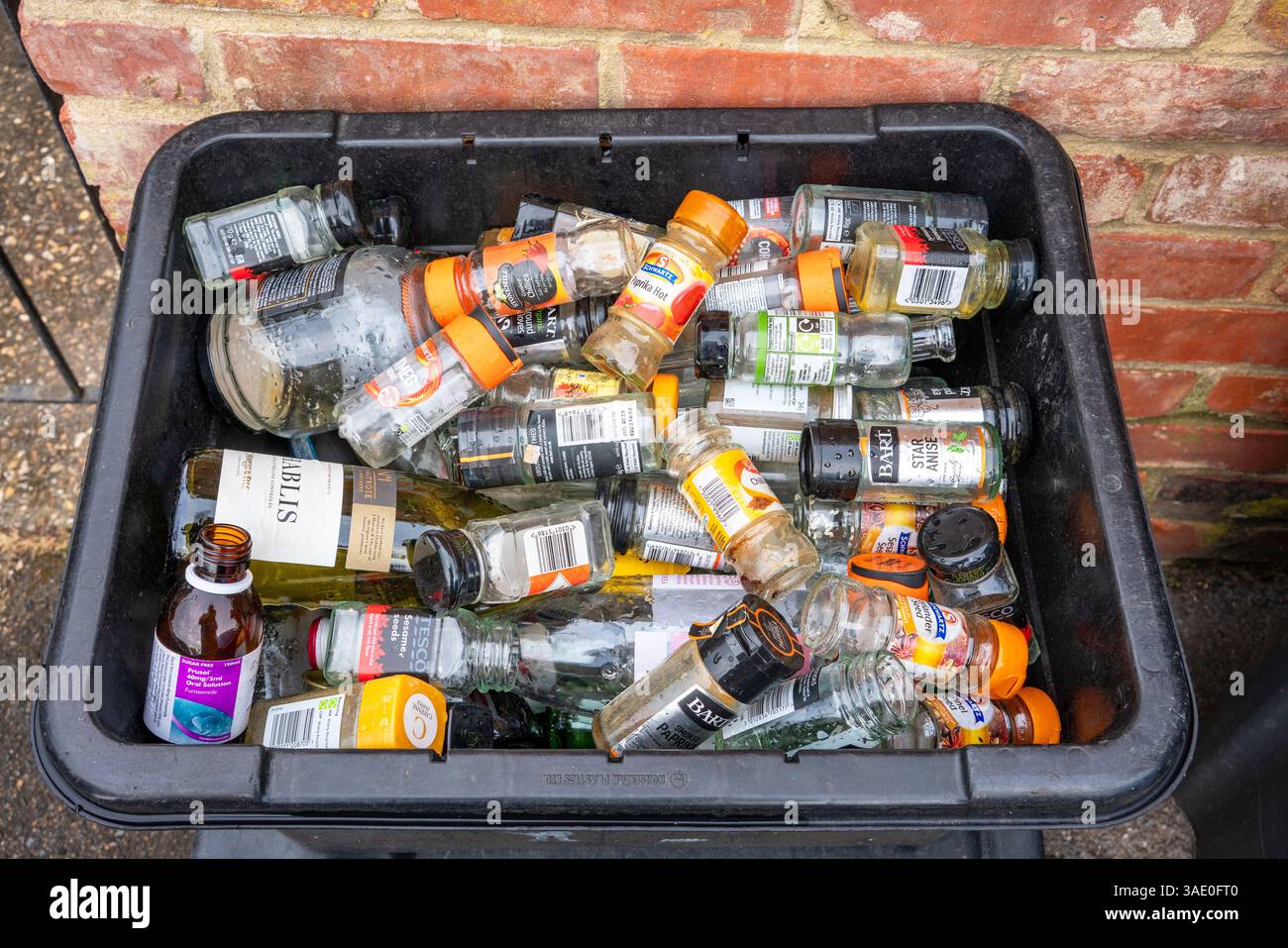 Glass jars and bottles for recycling in black plastic box Stock Photo ...