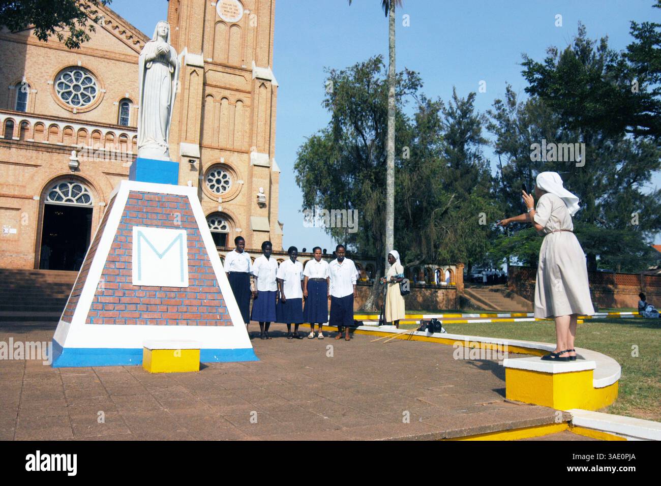 Nuns and Priests arrive for prayer while religion attracts the sellers ...