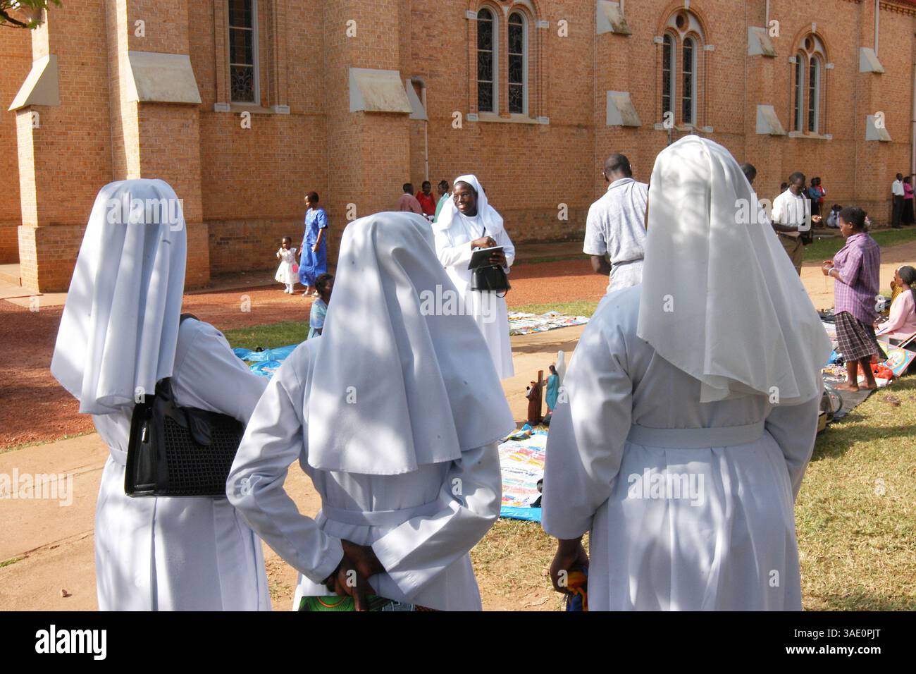 Nuns and Priests arrive for prayer while religion attracts the sellers ...