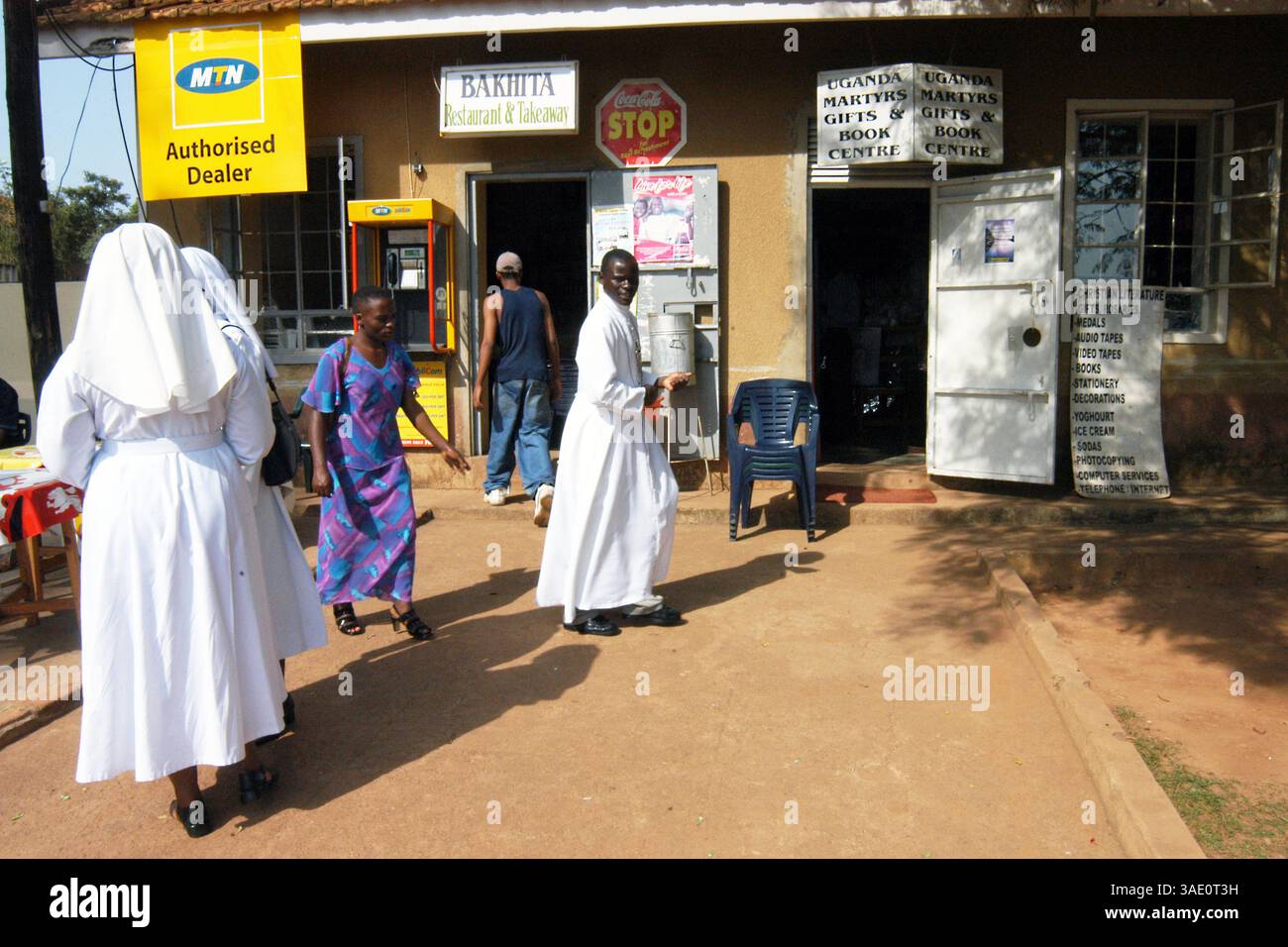 Nuns and Priests arrive for prayer while religion attracts the sellers ...