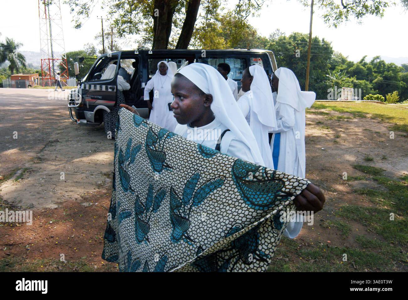Nuns and Priests arrive for prayer while religion attracts the sellers ...