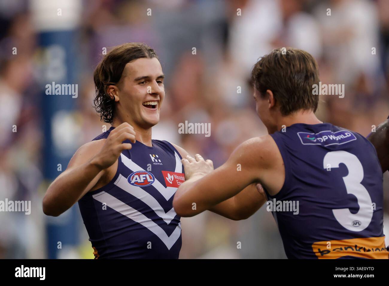 Murphy Reid (left) of the Dockers celebrates after kicking a goal ...