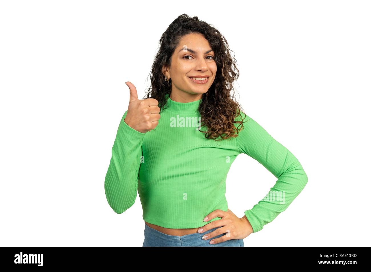 Smiling woman showing thumbs up gesture, conveying agreement and ...