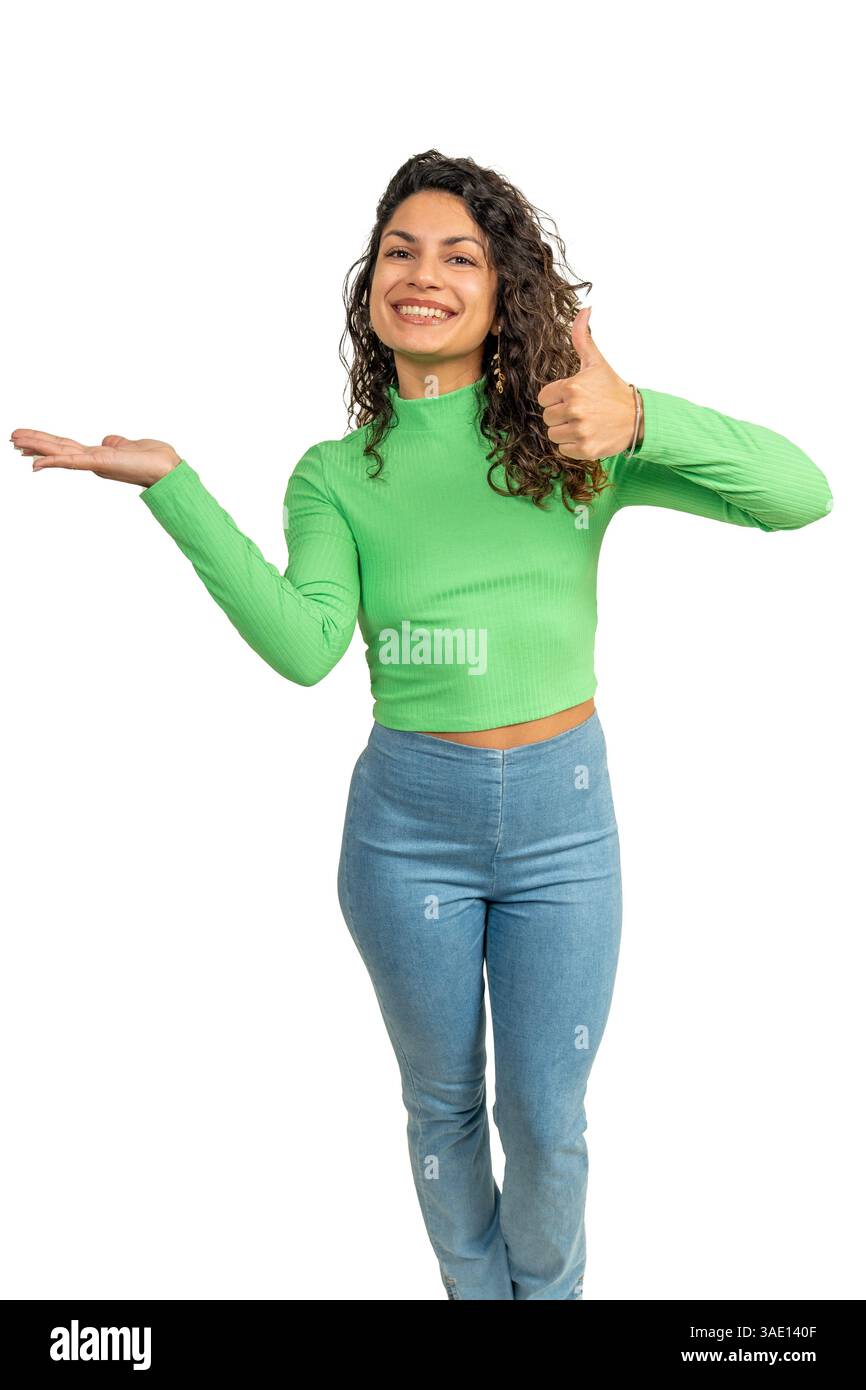 Cheerful young woman showing something on the palm of her hand and ...