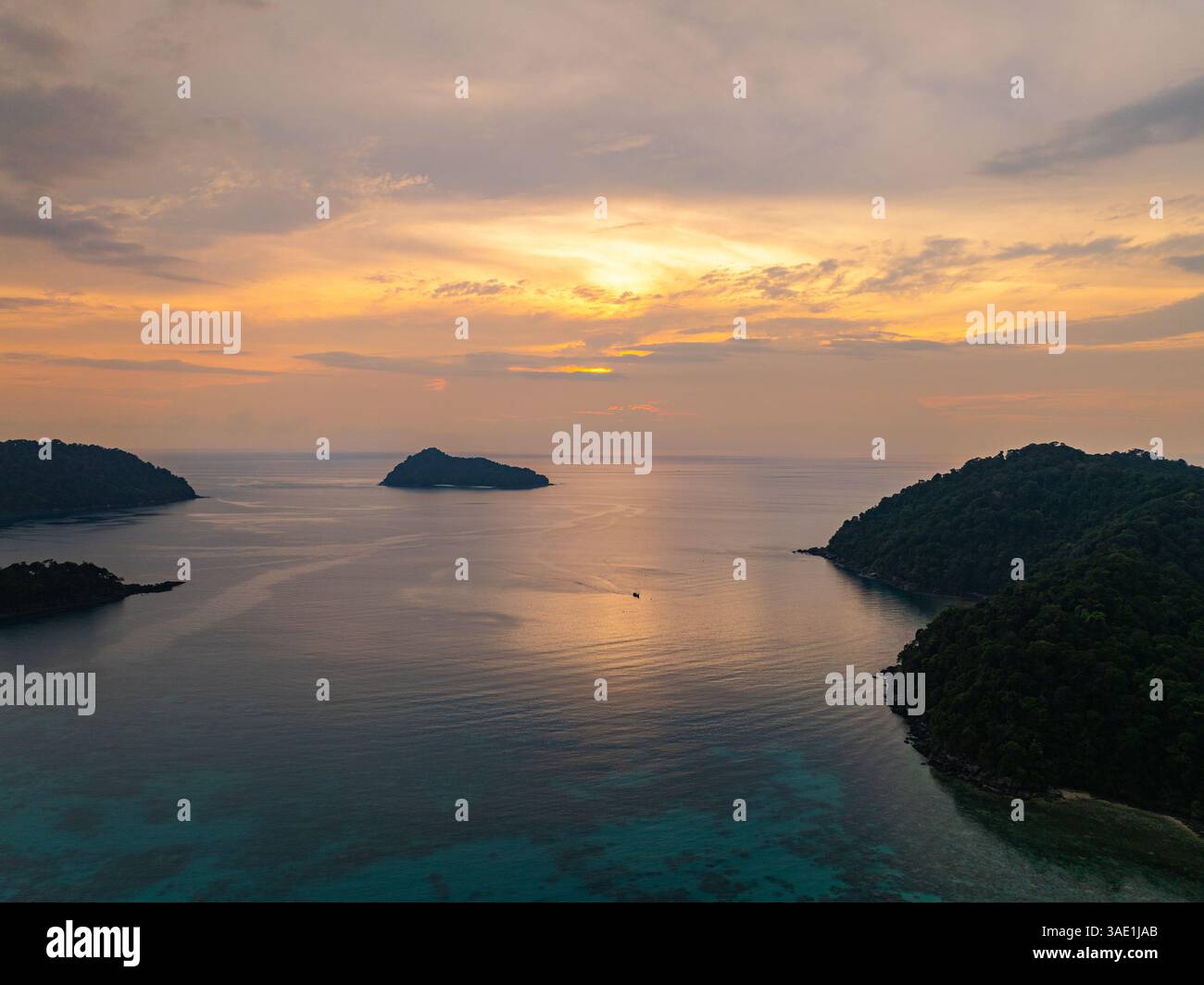 A breathtaking aerial view of tropical islands surrounded by calm ocean ...