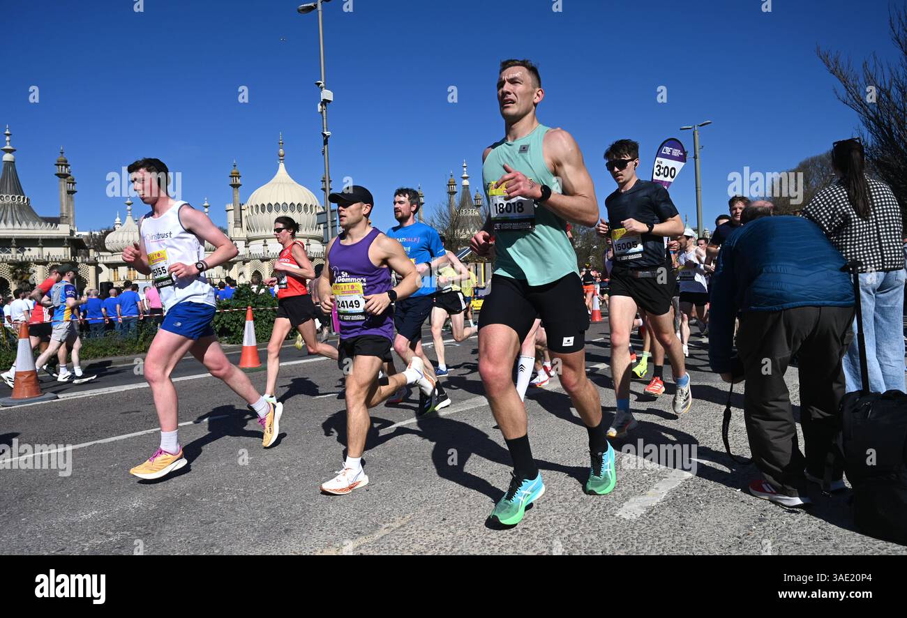 Brighton UK 6th April 2025 - Runners pass by the Royal Pavilion as ...