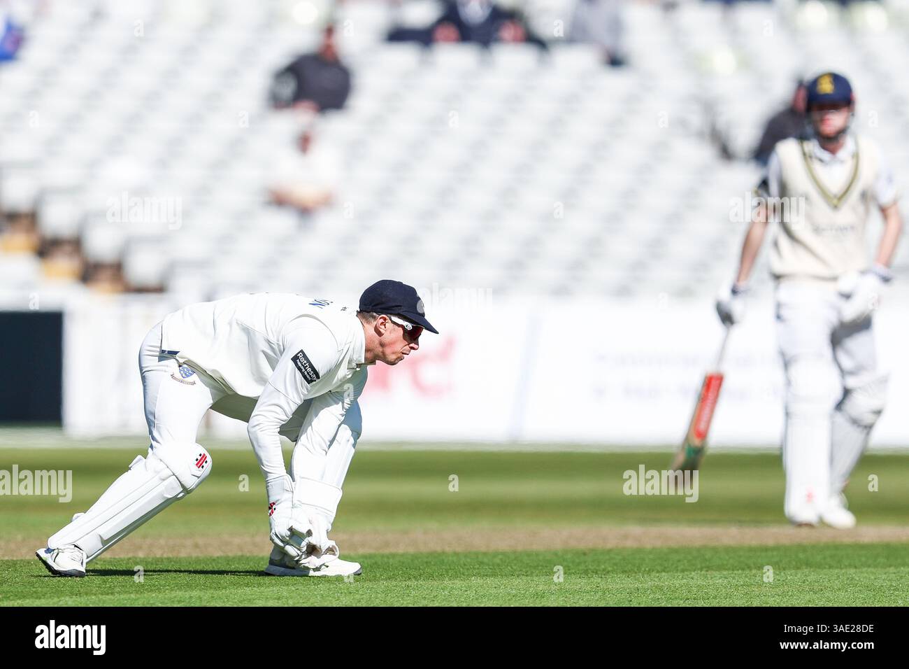 #9, John Simpson of Sussex collects a ball returned from the field ...