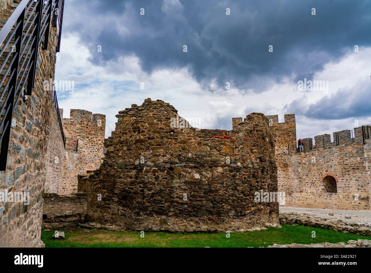 Travelers wander through the remnants of an old fortress hi-res stock ...