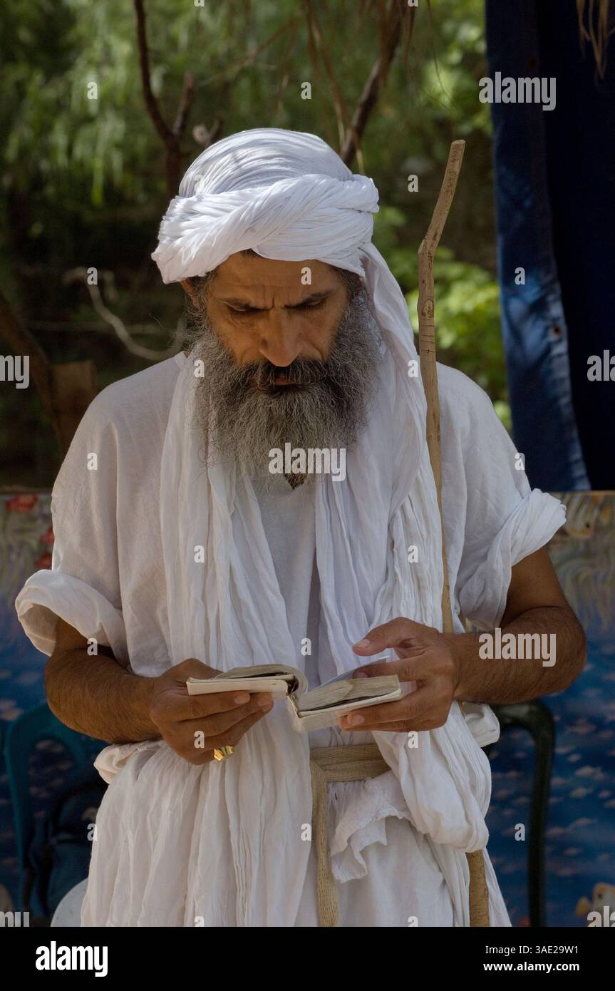 Priest performs baptism ceremony hi-res stock photography and images ...