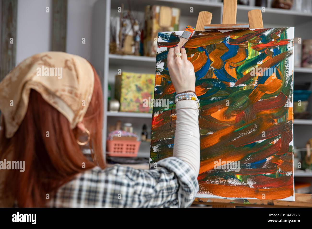A Creative Artist Passionately Painting An Abstract Canvas Inside A ...