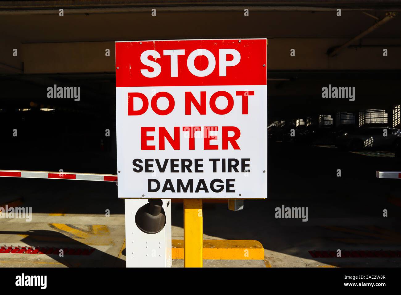 Public Garage Exit with "STOP Do Not Enter, Severe Tire Damage" Sign ...