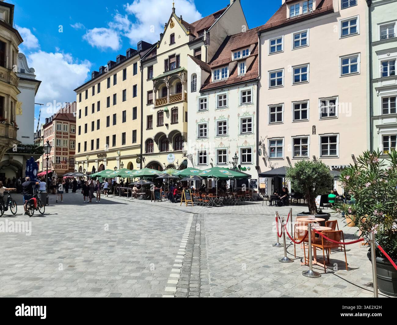 Munich, Germany - 22. June 2024: People walking and relaxing at outdoor ...