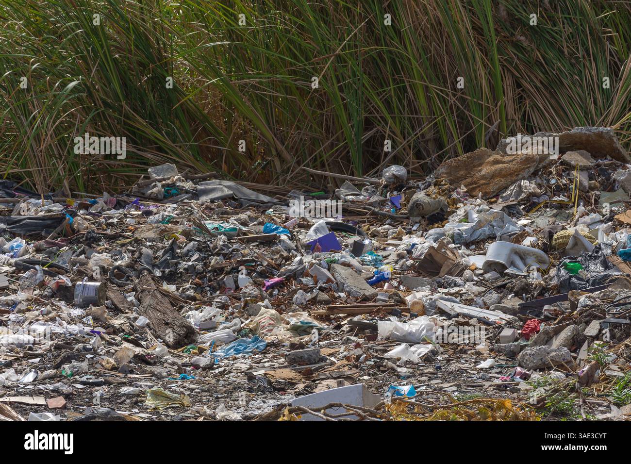 Garbage and junk dump to the landfill in field it illegal, hazardous ...