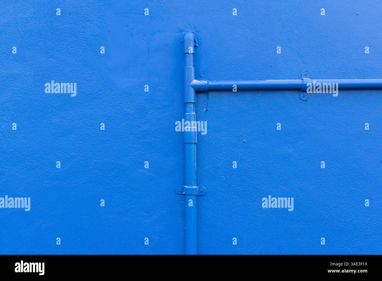 Minimalism style, Blue water pipe on blue wall texture background Stock ...