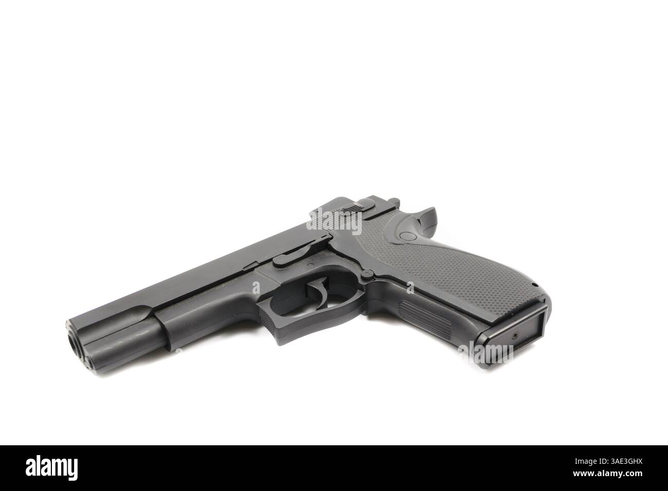 Black plastic gun isolated on white background Stock Photo - Alamy