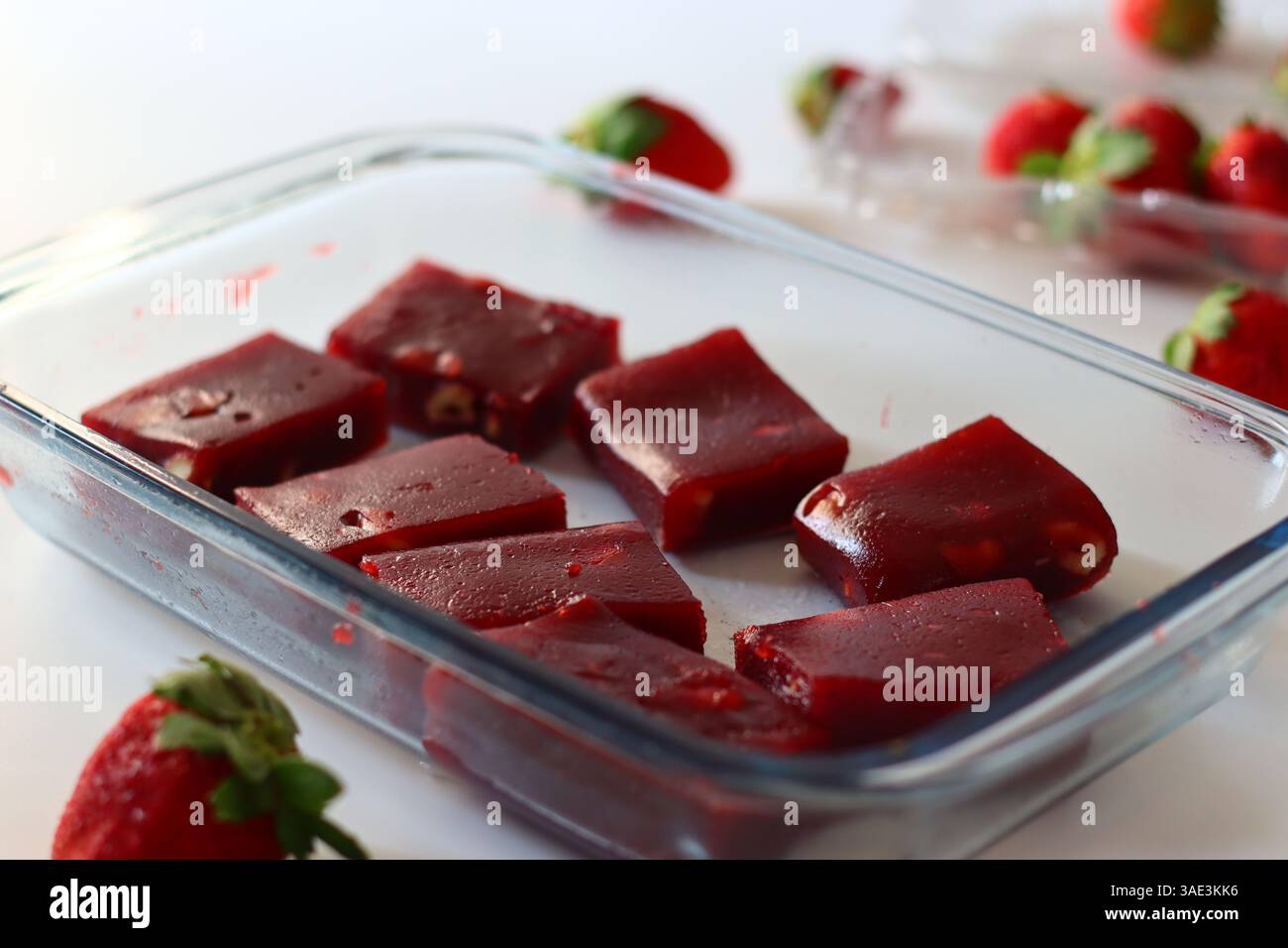 Strawberry halwa, a smooth Indian dessert with a rich pink hue. Served ...