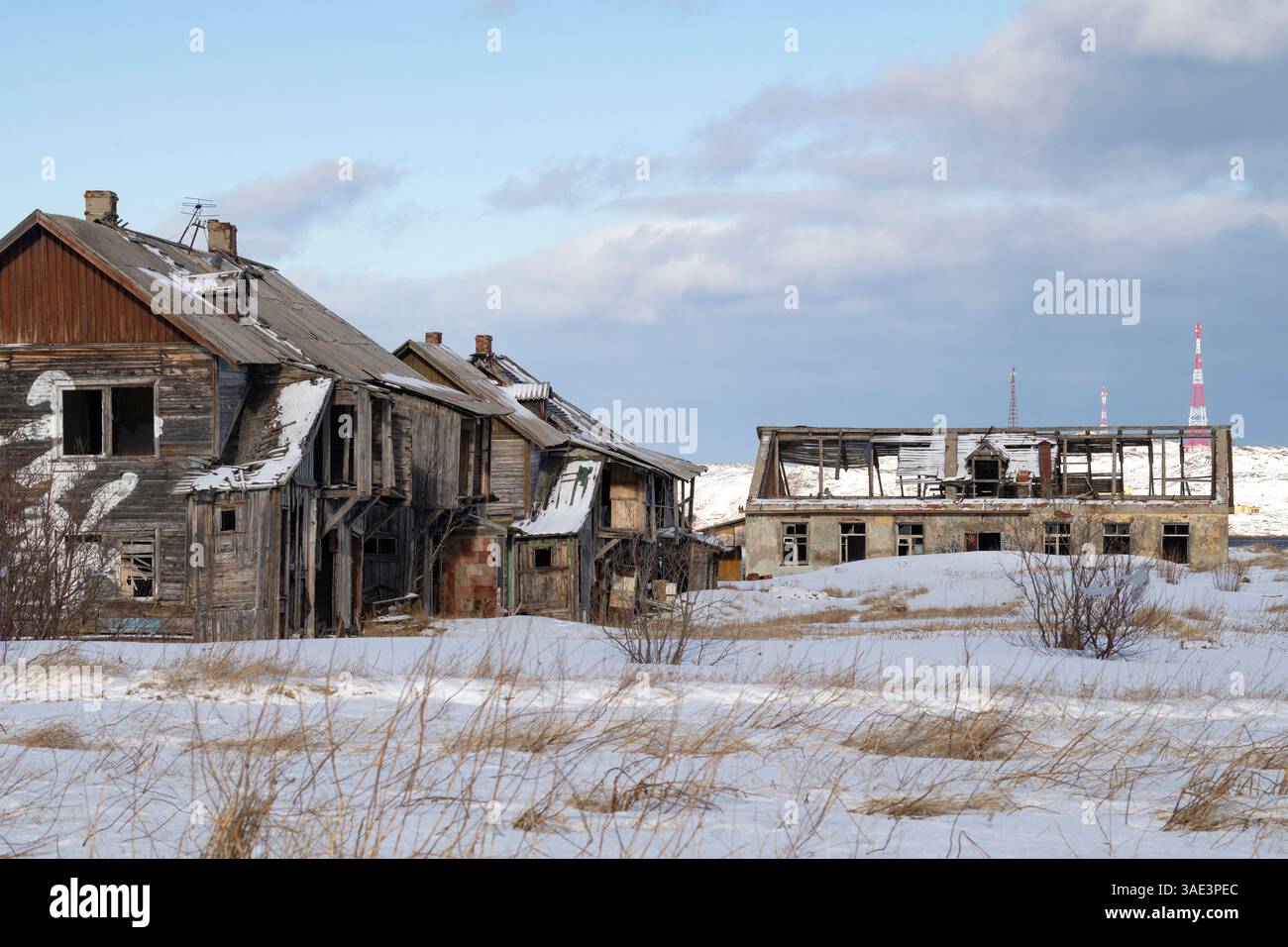 Old abandoned houses in the polar village of Teriberka on a March day ...