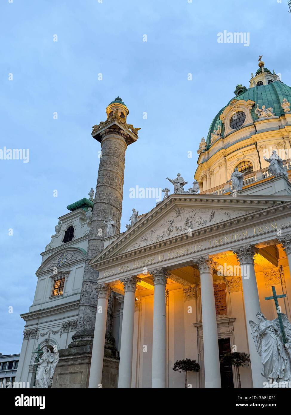 At twilight, a beautiful baroque structure stands prominently with its ...