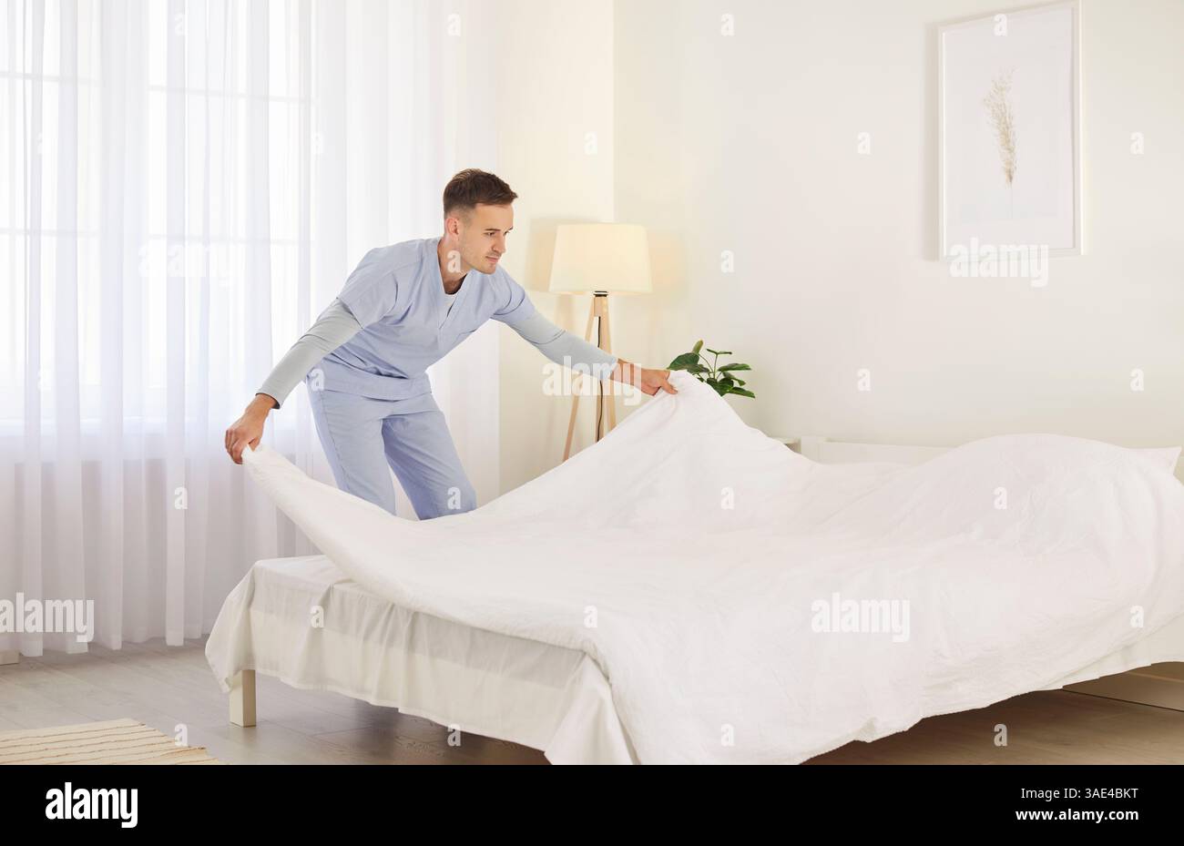 Doctor Or Caregiver Making Bed At Nursing Home Or Hospital Stock Photo ...