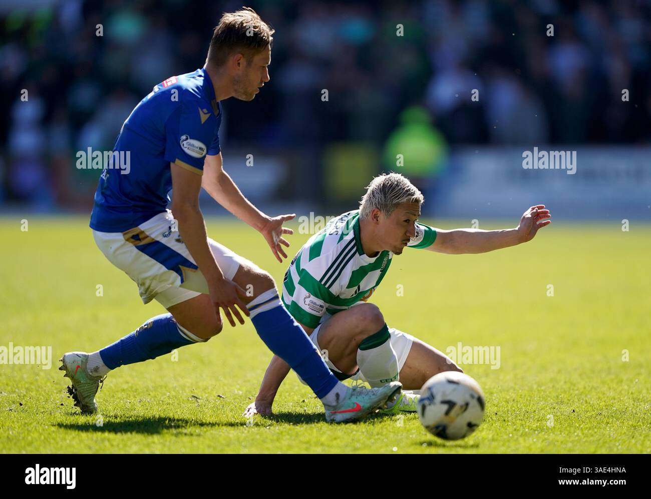 St Johnstone's Daniels Balodis (left) and Celtic's Daizen Maeda battle ...