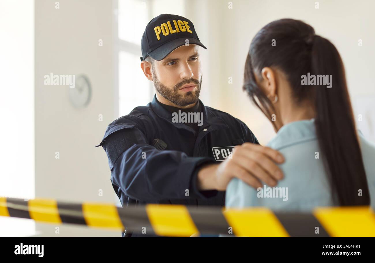 Policeman talking to witness who is victim of buglary, asking questions ...