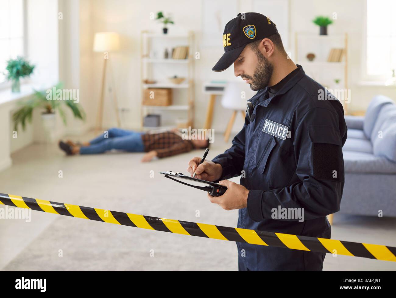 Police officer in uniform collecting evidence about recent murder ...