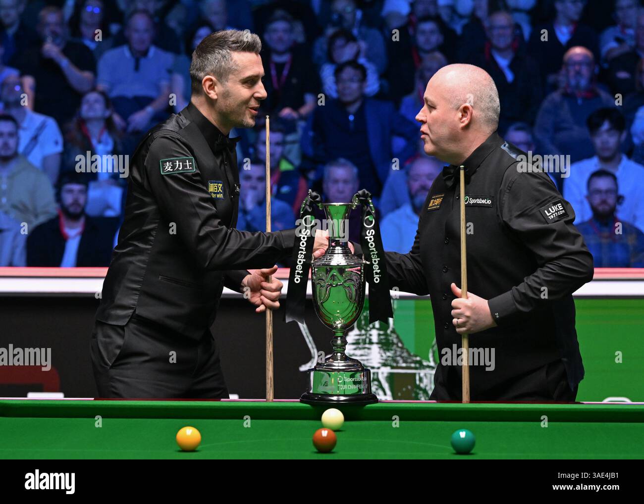 Manchester, UK. 6th Apr, 2025. John Higgins and Mark Selby shake hands ahead of 2025 Sportsbet ...