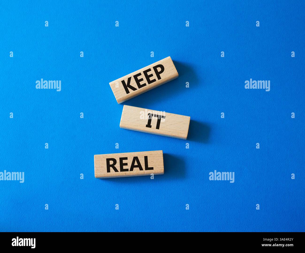 Keep it real symbol. Concept word Keep it real on wooden blocks ...